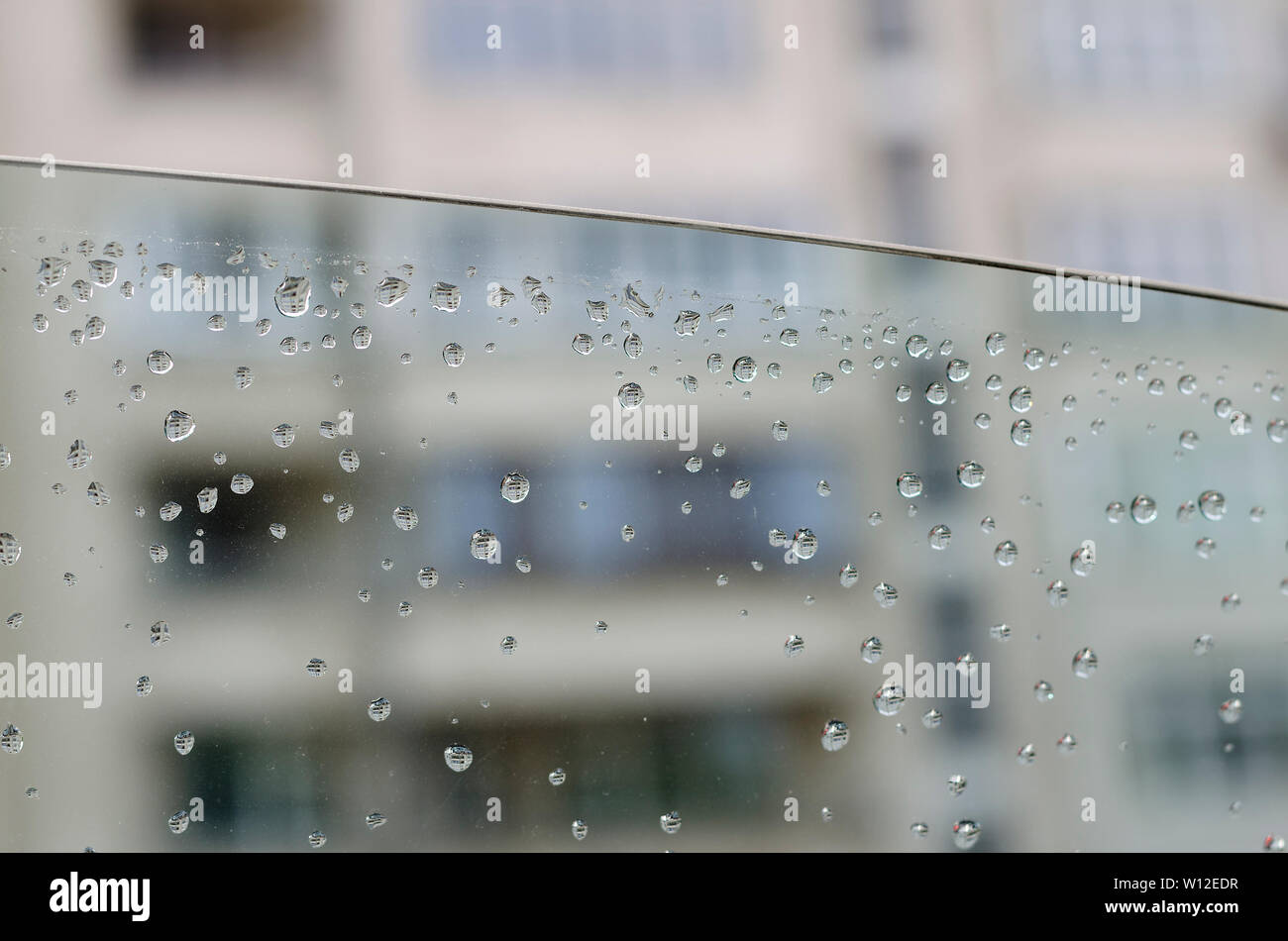 Raindrop on glass front car hi-res stock photography and images - Alamy