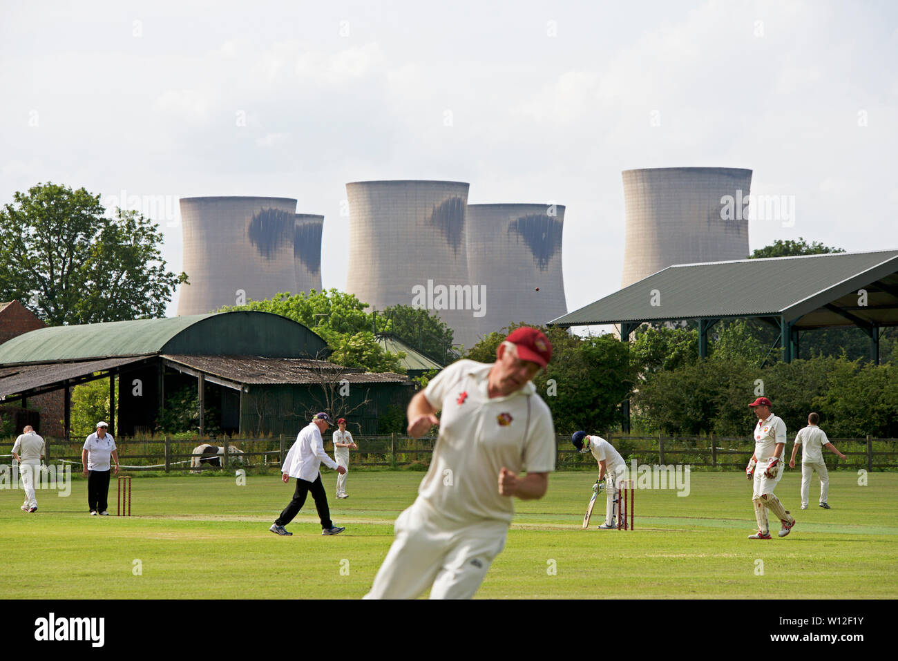 Cricket match in progress in the village of Drax, overlooked by the ...