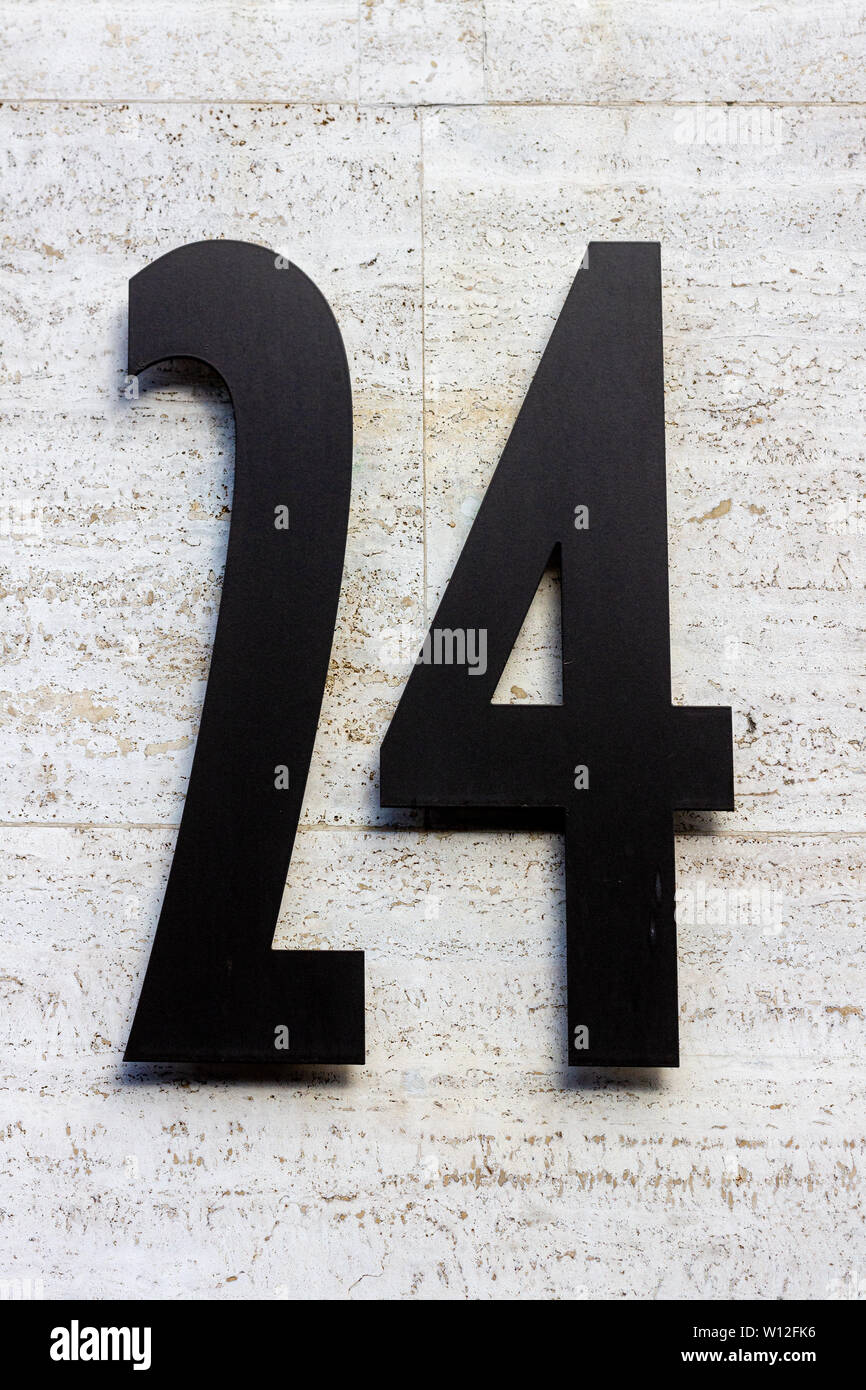 Large house number 24 in black on white marble Stock Photo - Alamy