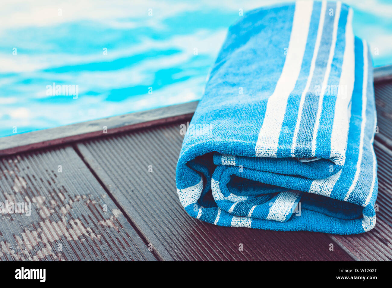 blue towel near swimming pool, tropical background Stock Photo - Alamy