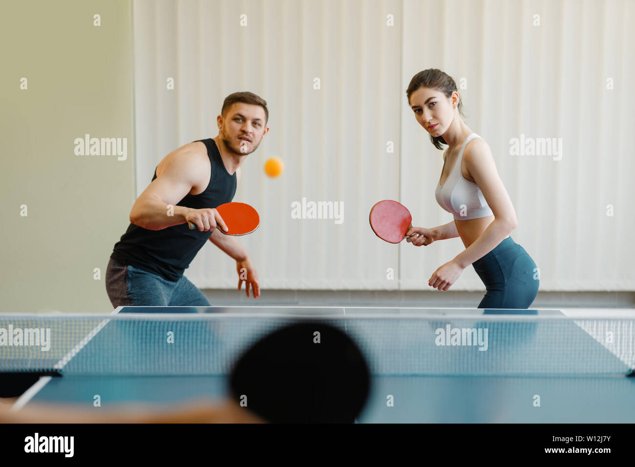 Friends playing sport game, group ping pong Stock Photo - Alamy