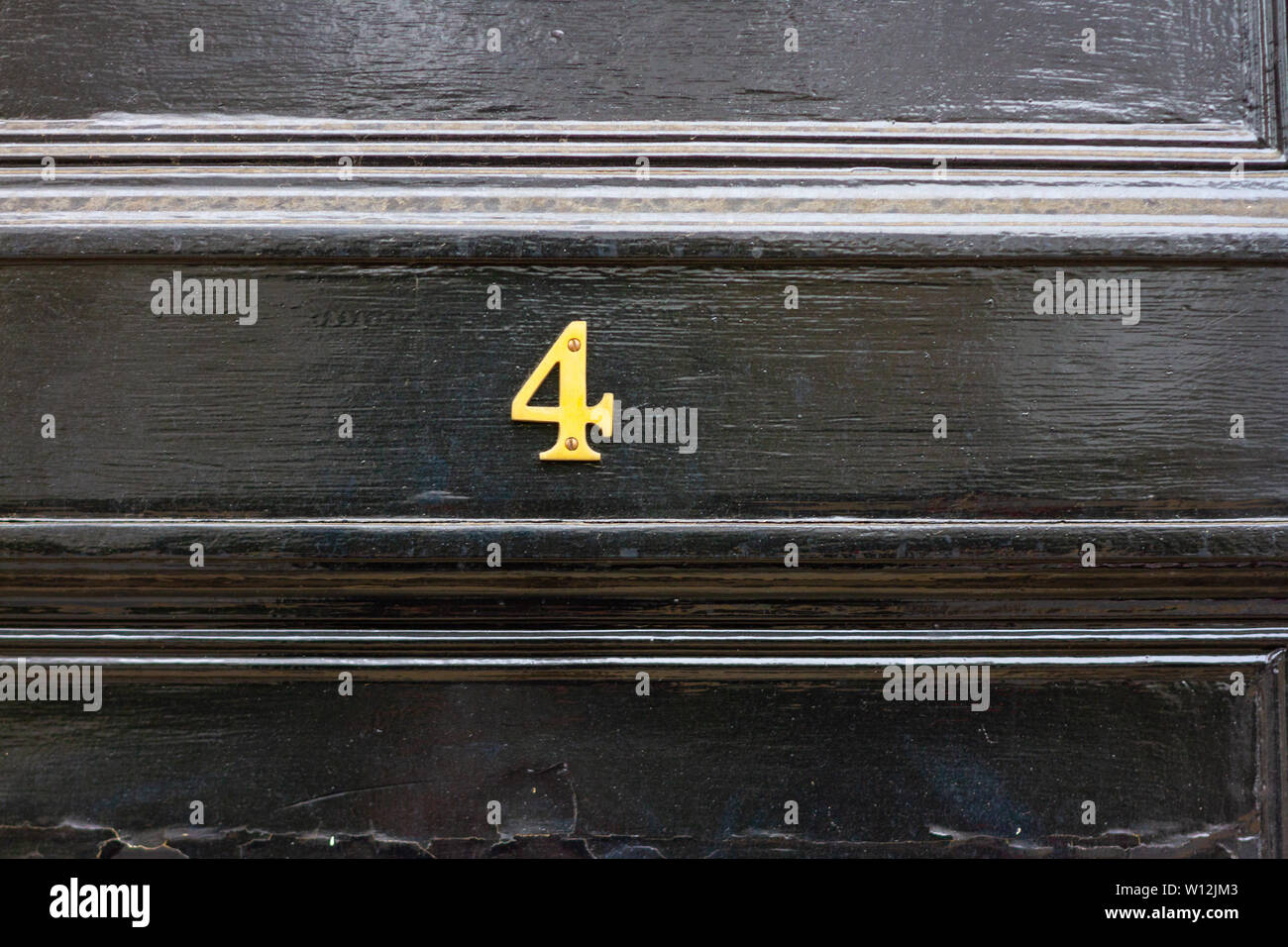 House number 46 with the forty-six in metal digits on a black painted ...