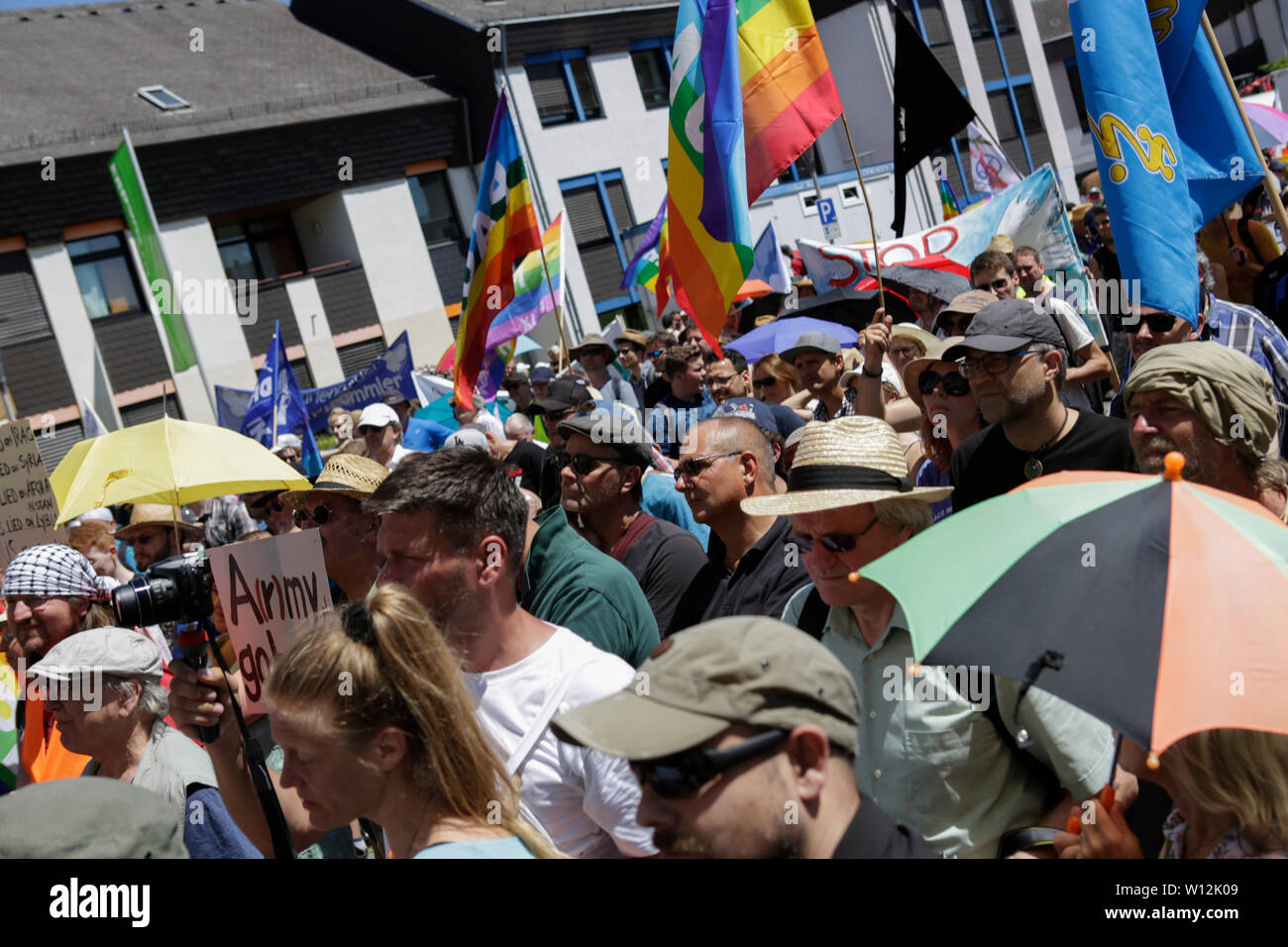 Ramstein, Germany. 29th June 2019. The protesters listen to the ...