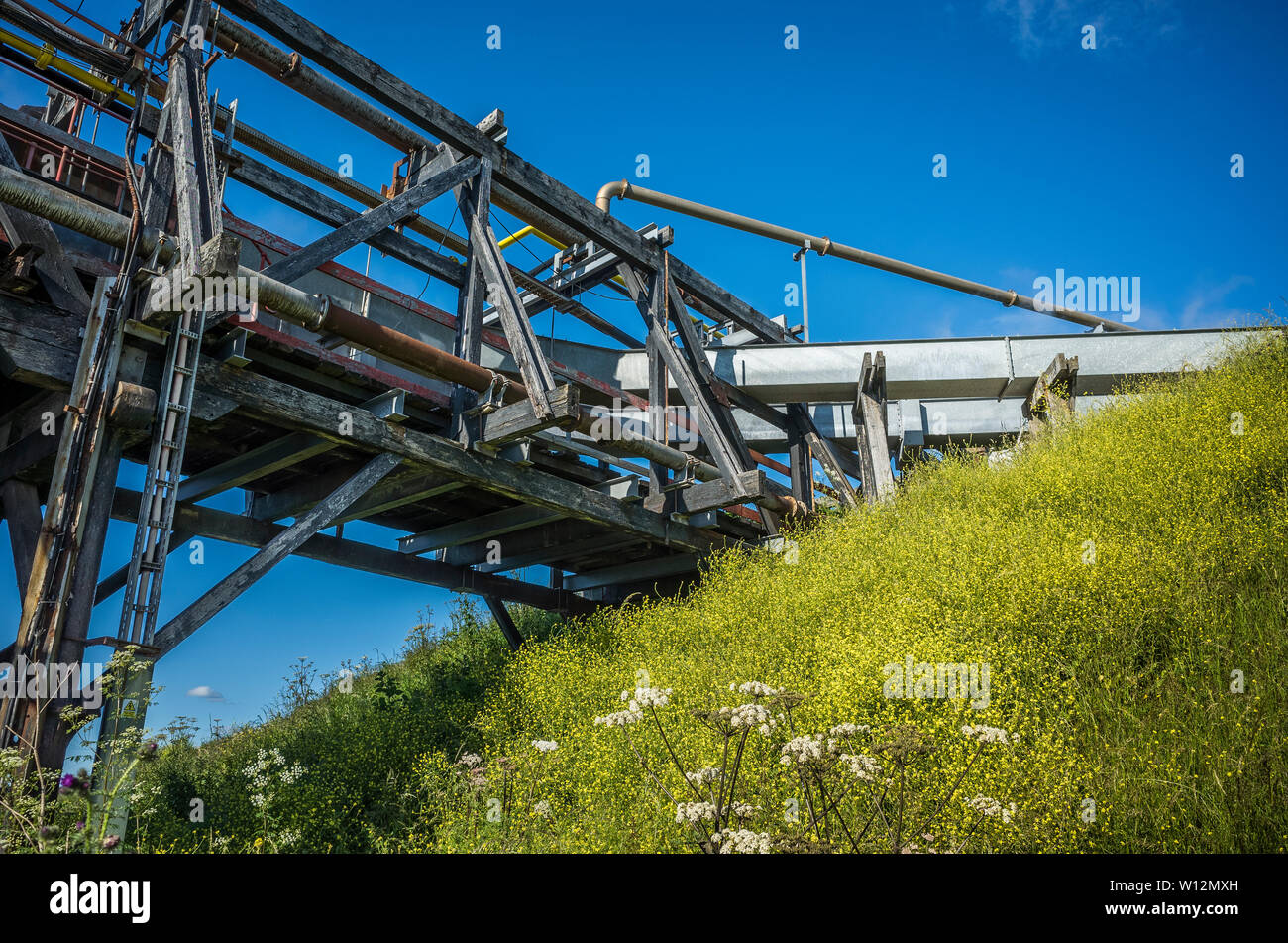Industrial pipeline structure elevated across rural countryside Stock ...