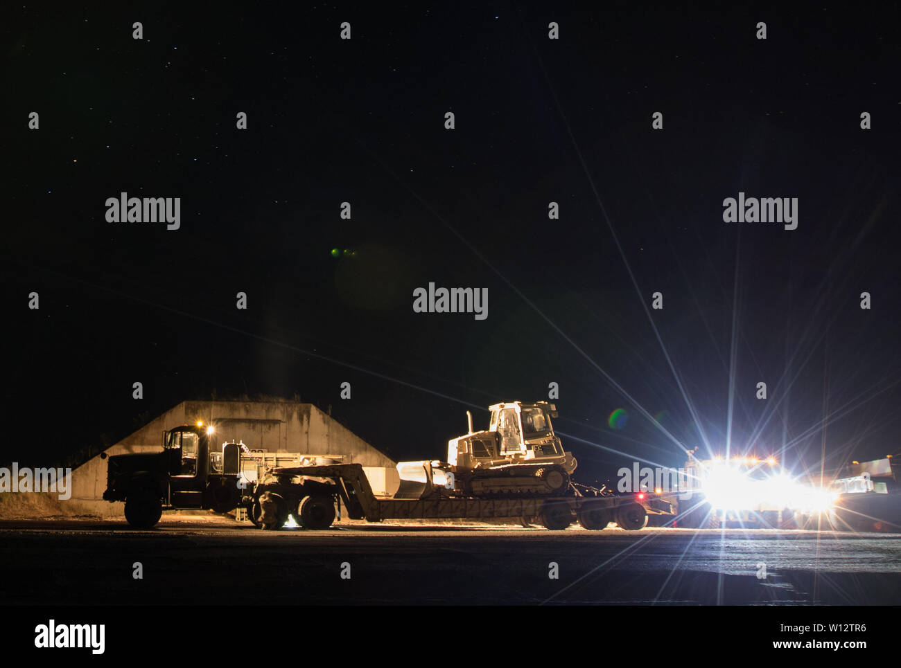 A mechanic with 224 Engineer Maintenance Company, inspects the tire ...