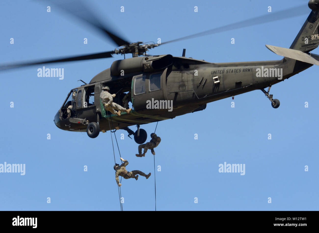 Army Soldiers take part in the rappelling portion of Air Assault School ...