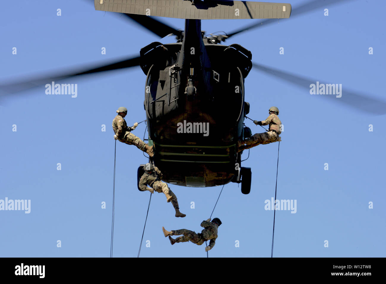 Army Soldiers take part in the rappelling portion of Air Assault School ...