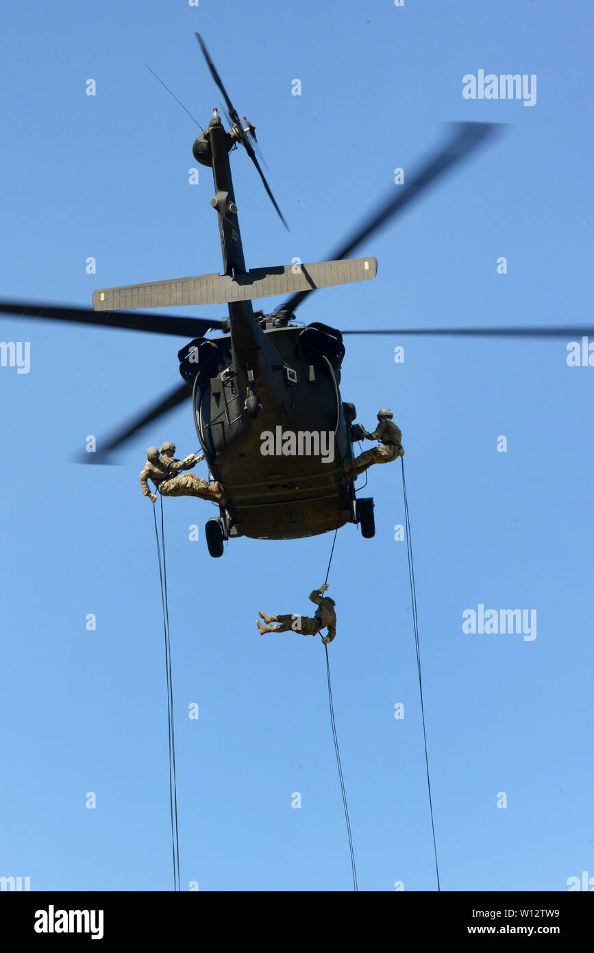 Army Soldiers take part in the rappelling portion of Air Assault School ...