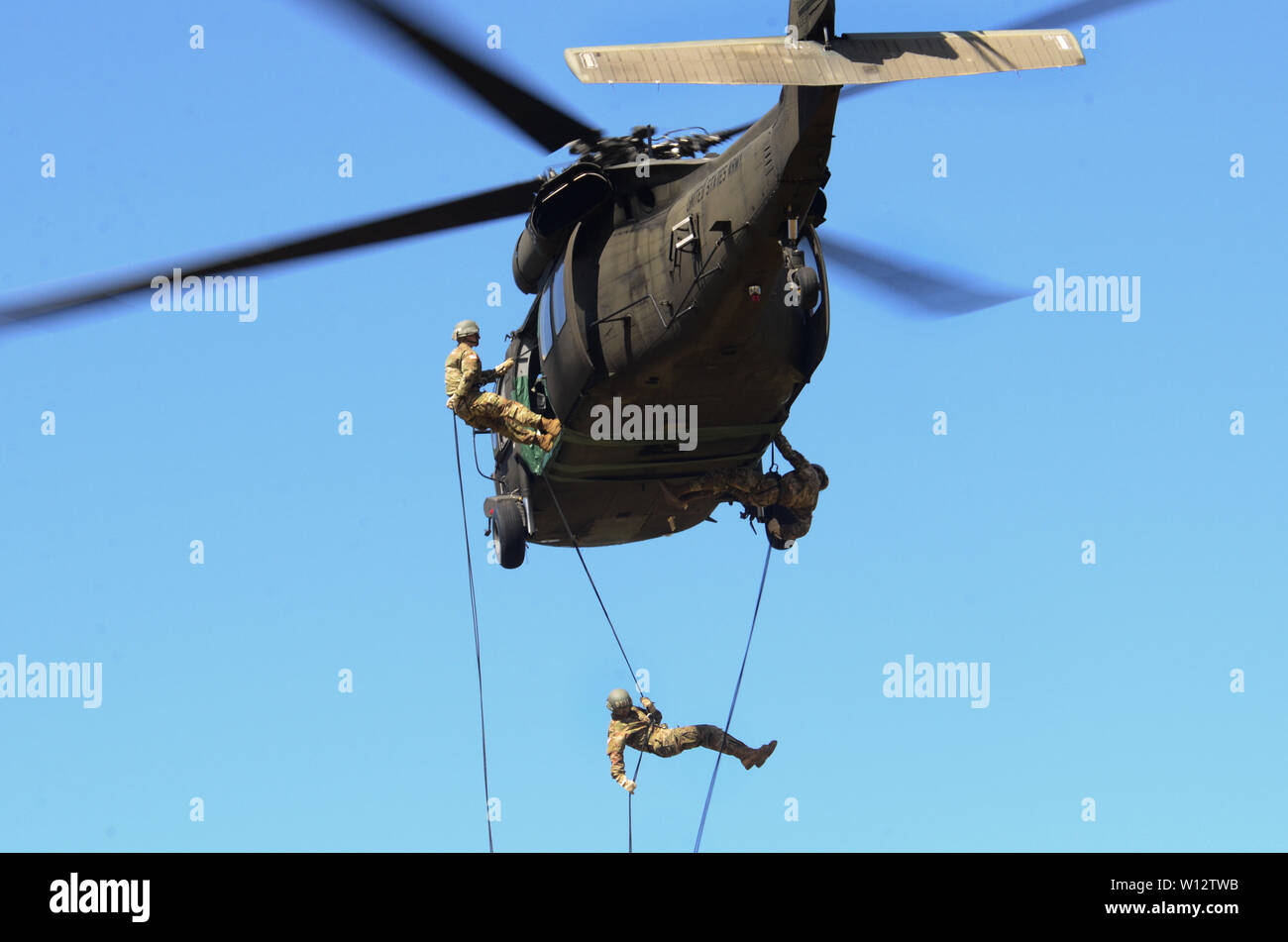 Army Soldiers take part in the rappelling portion of Air Assault School ...