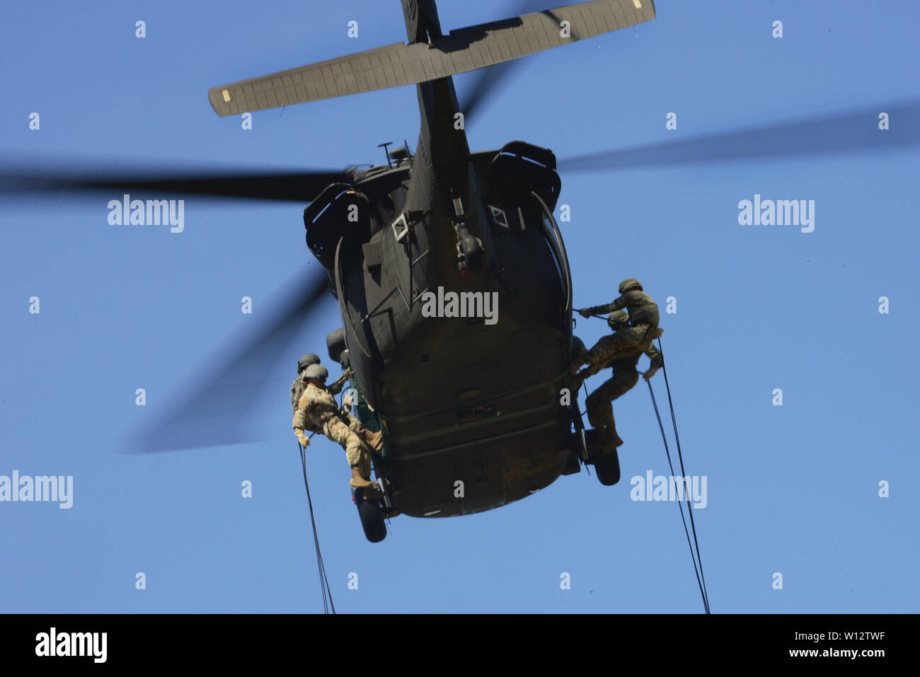 Army Soldiers take part in the rappelling portion of Air Assault School ...