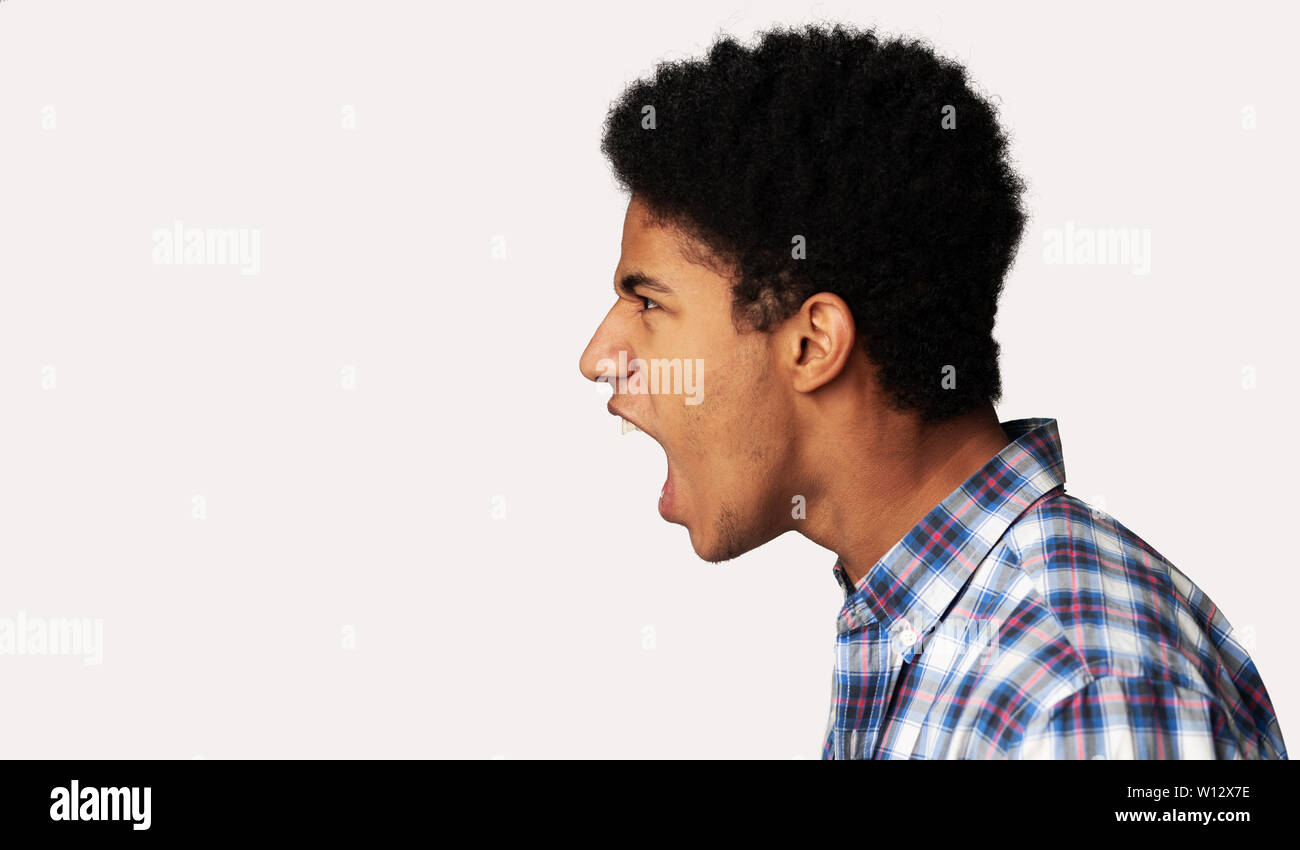 Furious Afro Guy Shouting over Light Background Stock Photo - Alamy