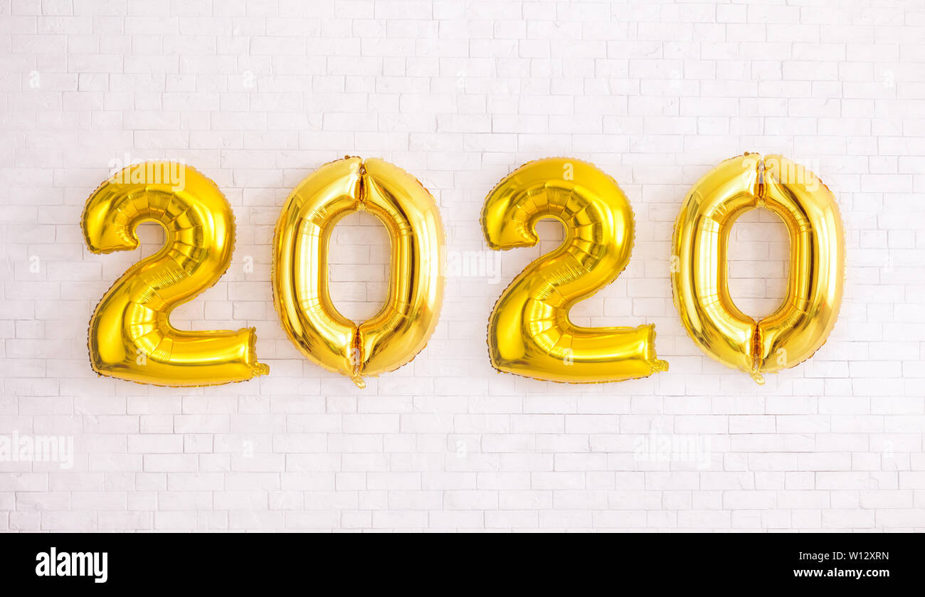 Gold Party balloons in 2020 numbers shape on white background Stock ...