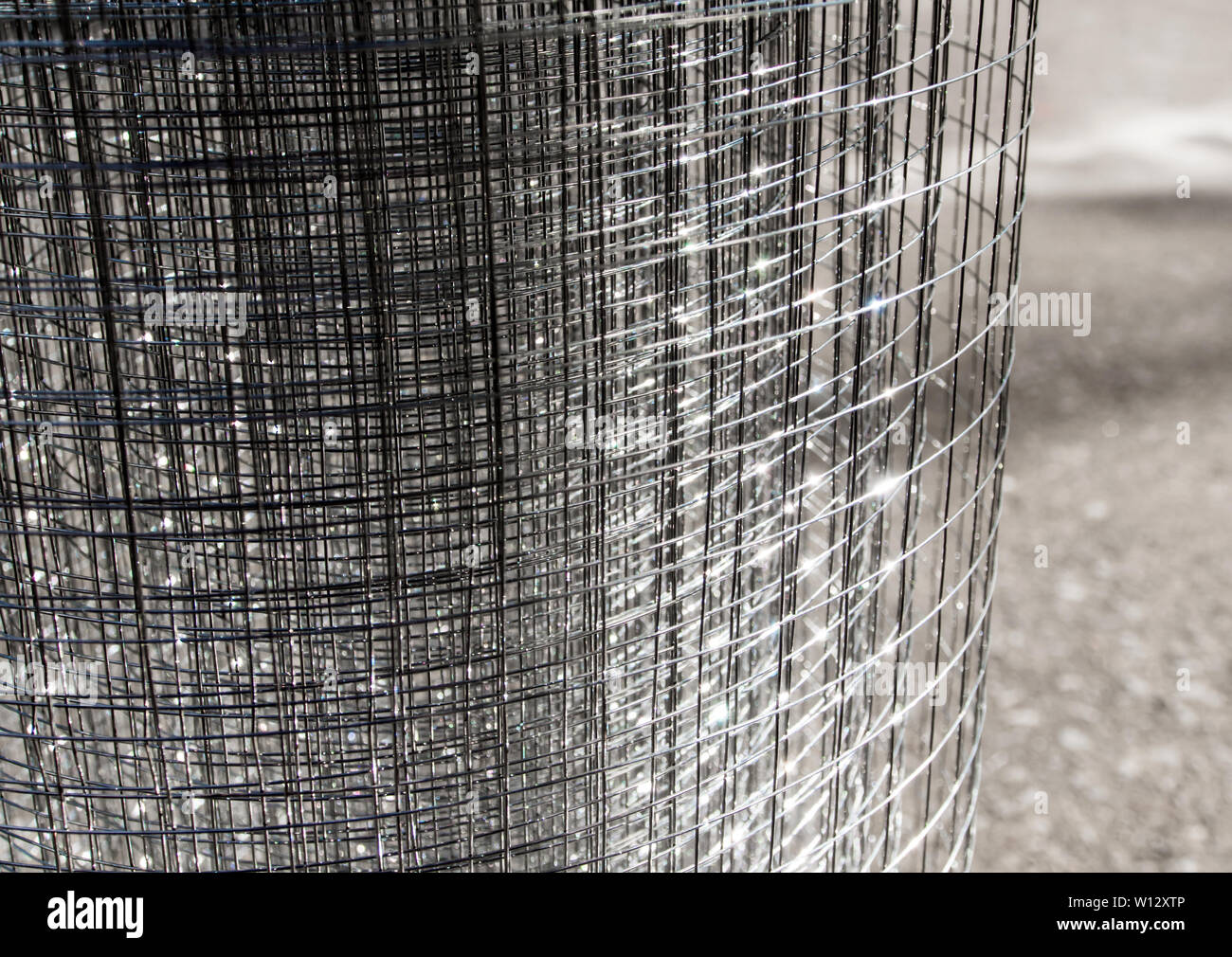 Roll loose shiny thin steel wire grating Stock Photo - Alamy