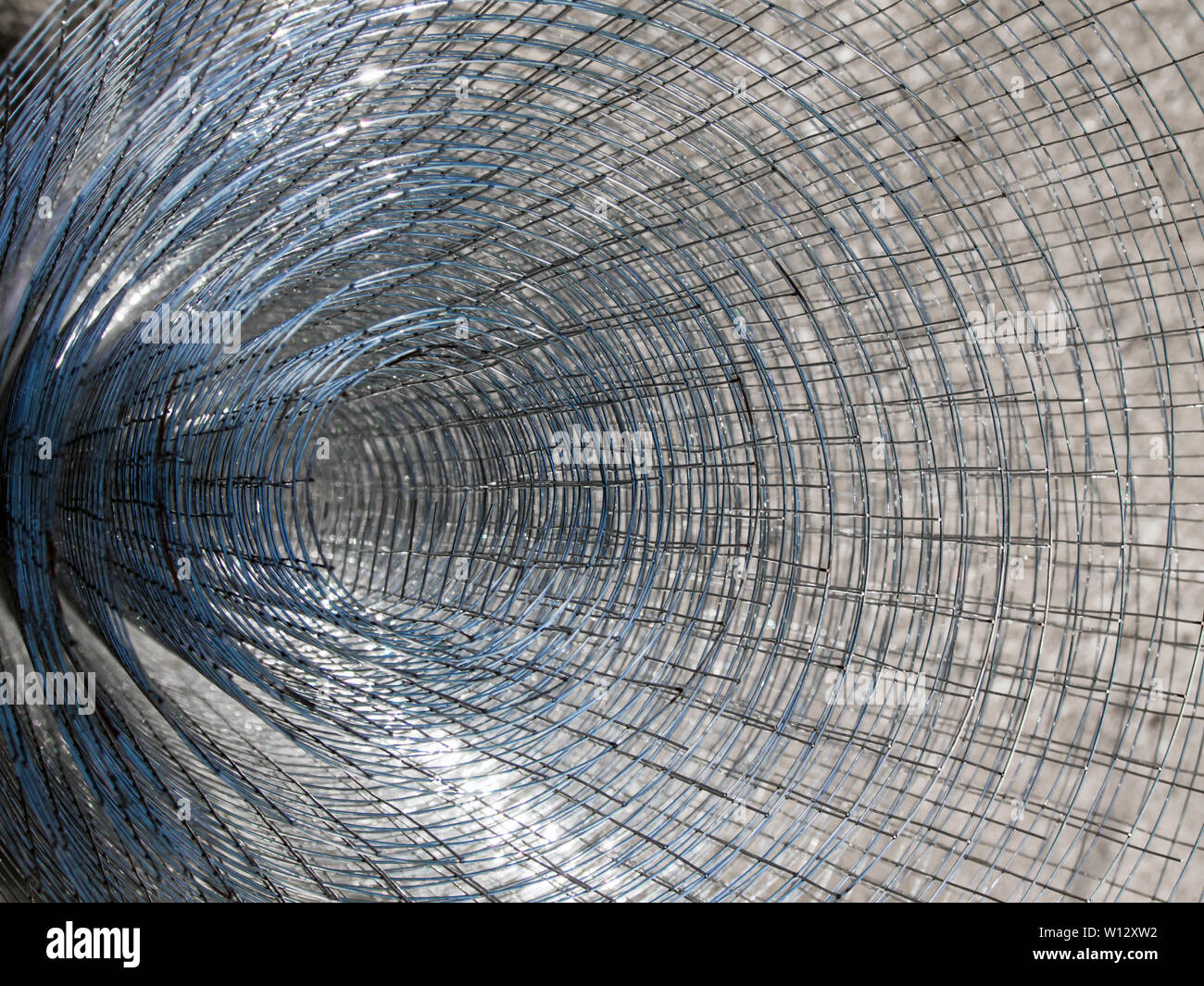 Roll loose shiny thin steel wire grating Stock Photo - Alamy