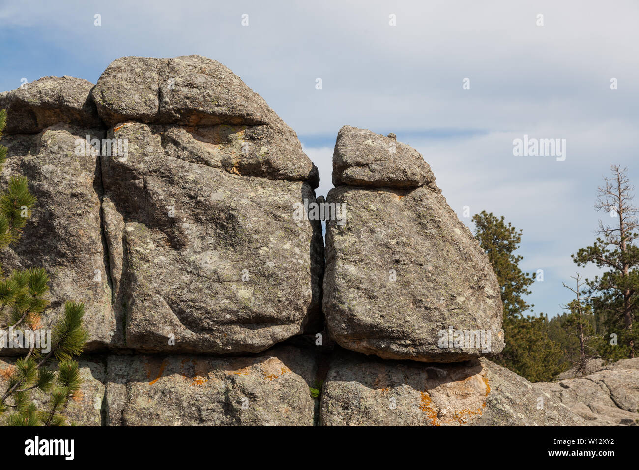 Large granite rock formations and trees along the shoreline of Sylvan ...