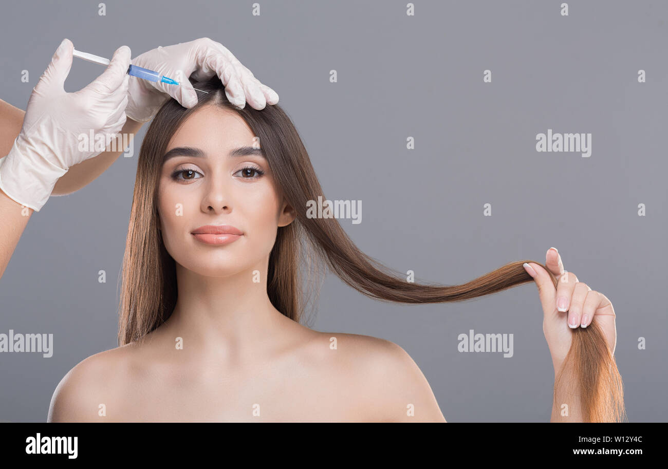 Woman getting cosmetics injection in head, free space Stock Photo - Alamy