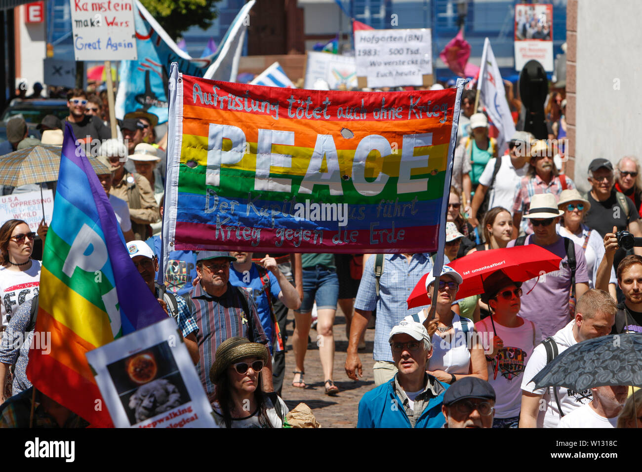 Ramstein, Germany. 29th June, 2019. Protesters hold a Peace banner.A ...