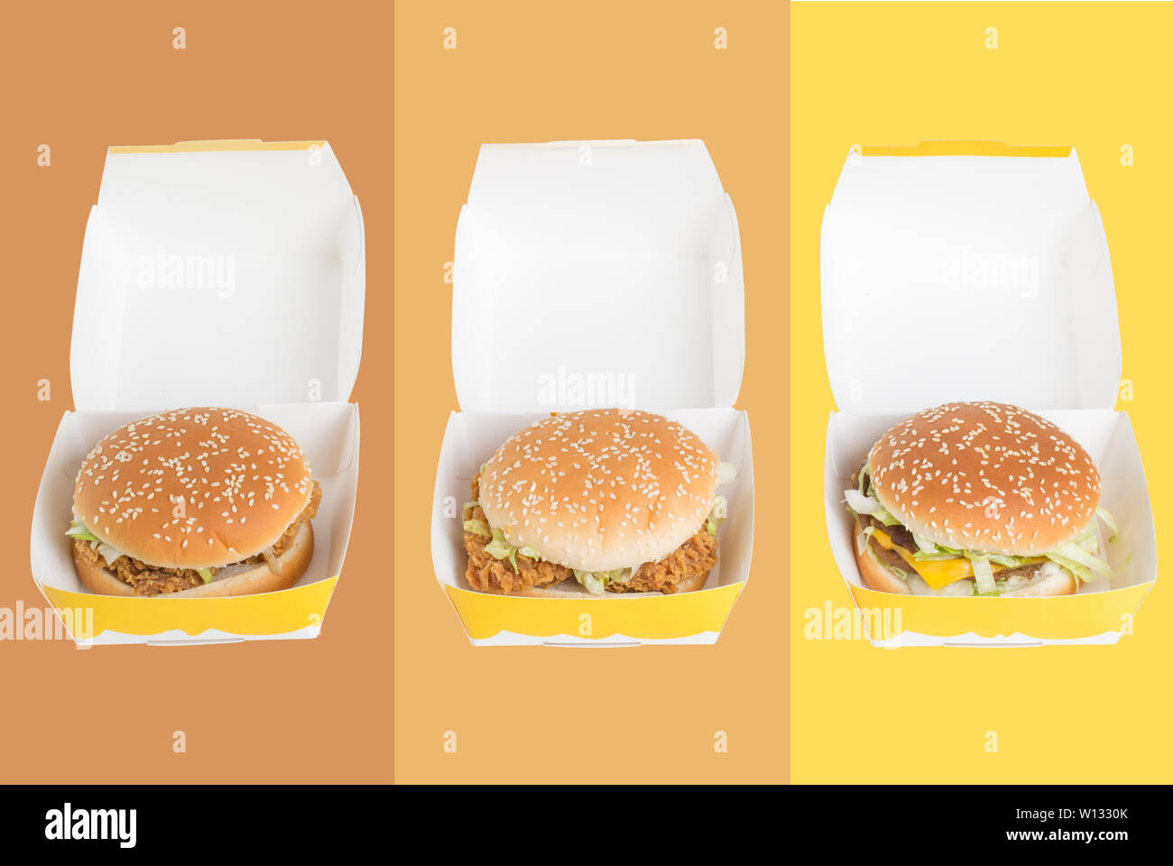 Three burgers in their respective boxes Stock Photo - Alamy
