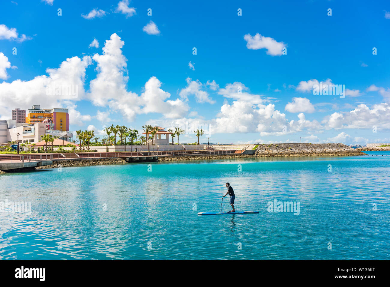 man doing paddle surfing in the Hamakawa fishing port in the vicinity ...