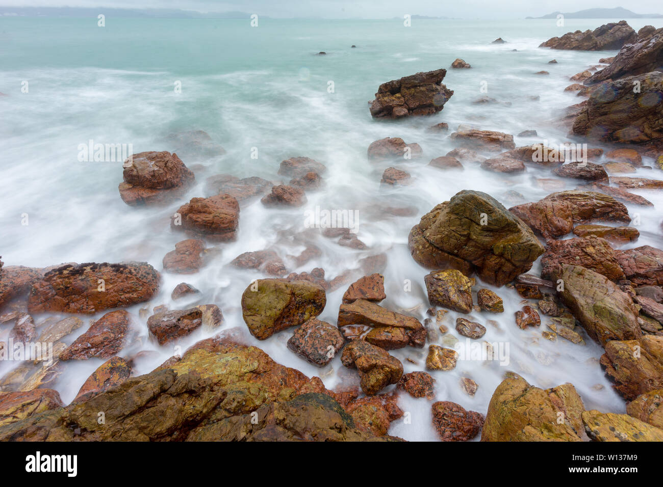 Dapeng seaside stone reef group sea scenery Stock Photo - Alamy