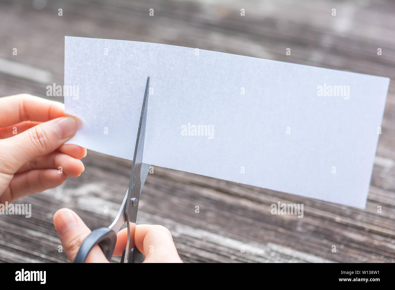 Human hands holding scissors hi-res stock photography and images - Alamy