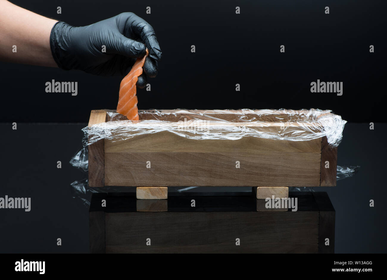 Cook prepares fresh fish hi-res stock photography and images - Alamy