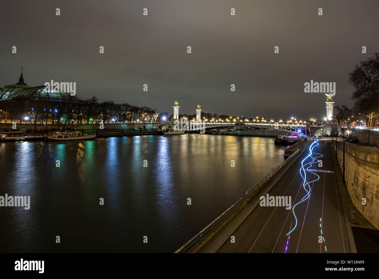Pont Alexandre III in Paris at night. This bridge is one of the most ...