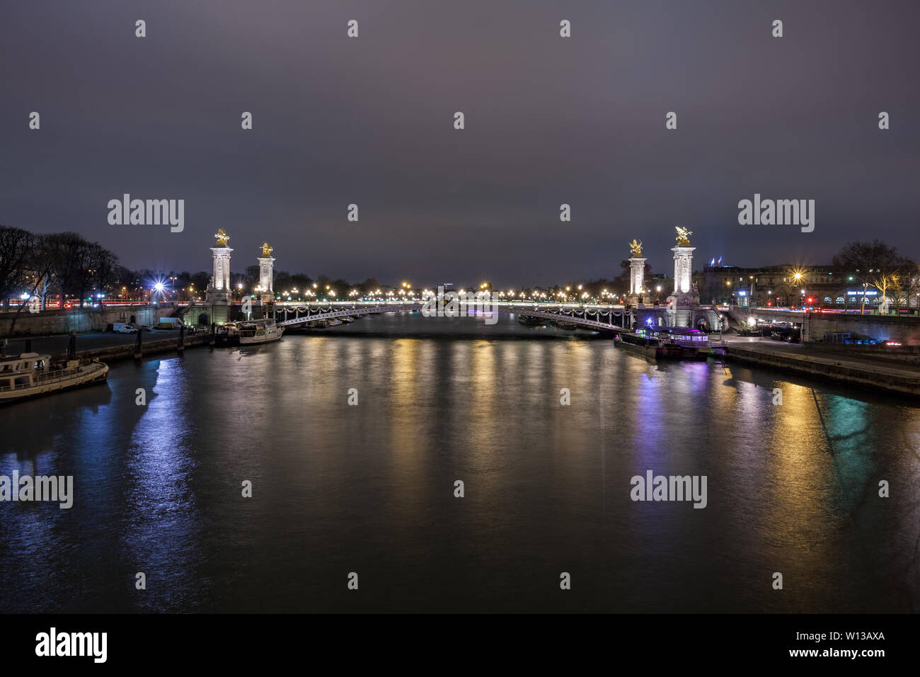 Pont Alexandre III in Paris at night. This bridge is one of the most ...