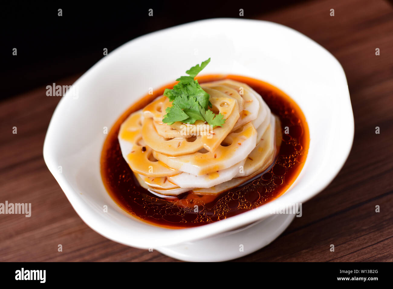 Spicy, sour, spicy lotus root slices Stock Photo - Alamy