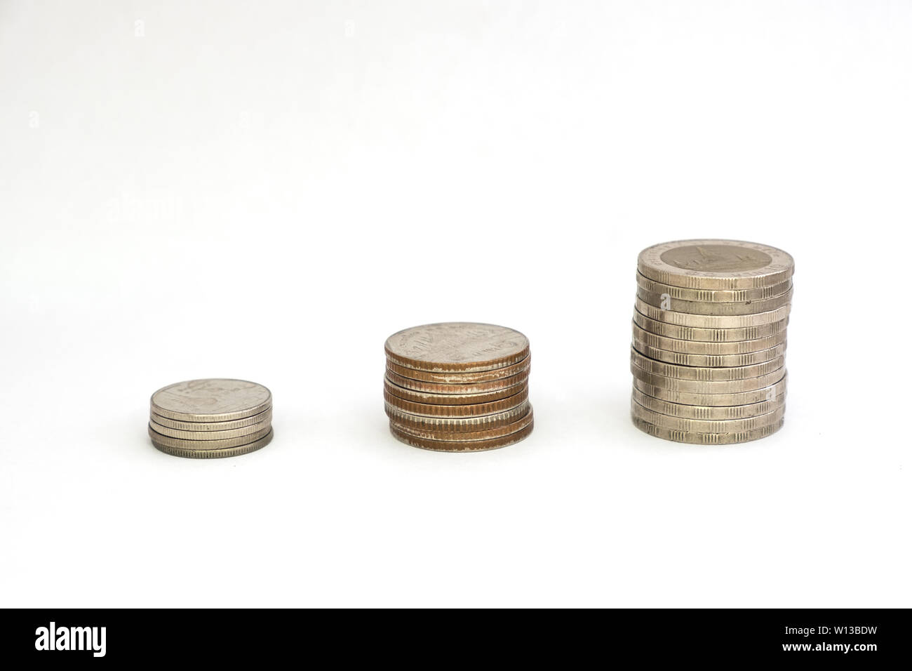 Stack coins growing or saving,isolated on white background Stock Photo ...