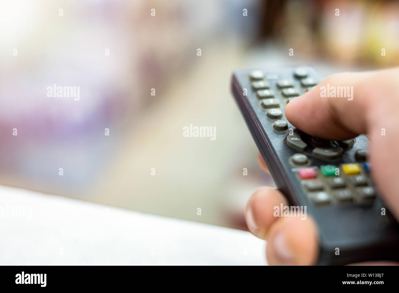 Hand tv remote turning off hi-res stock photography and images - Alamy