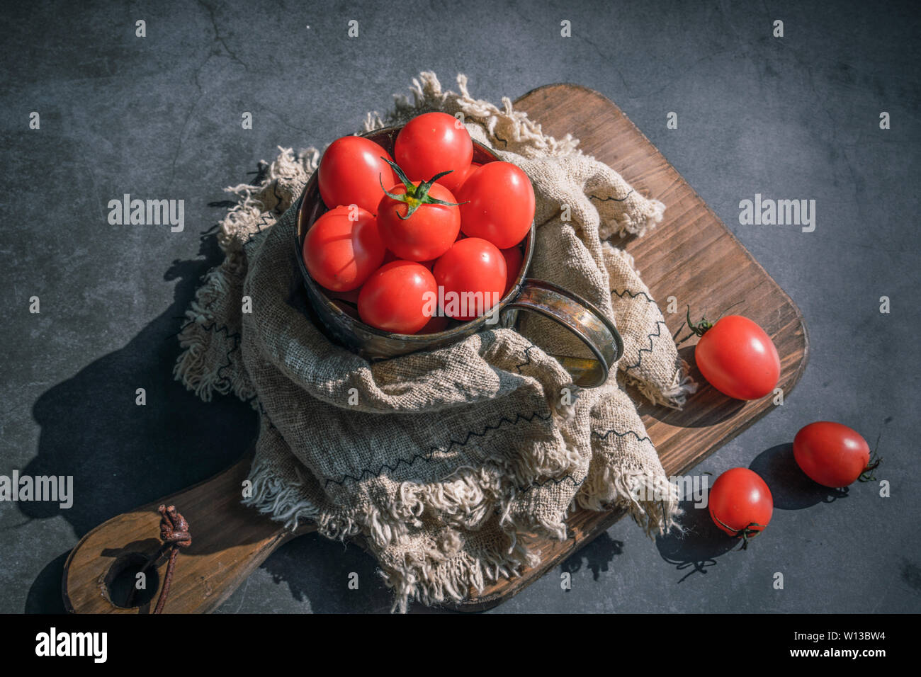 Delicious little tomato pendulum Stock Photo - Alamy