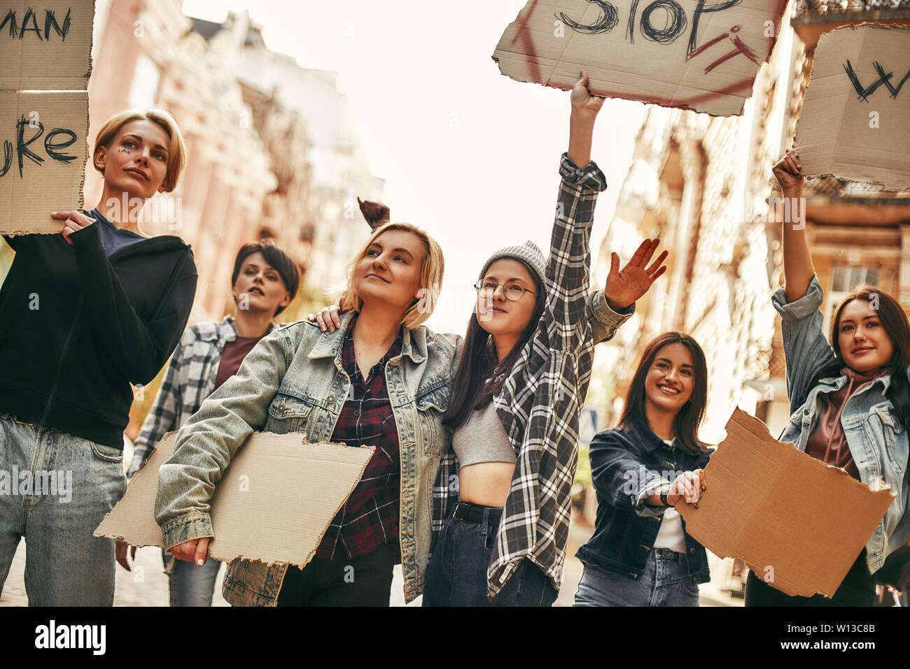 Stop violence against women. Group of young female activists are ...