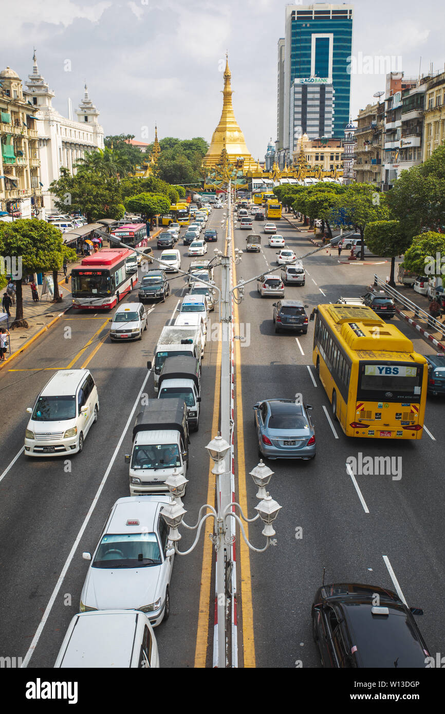 View on the Yangon city downtown with traffic and golden stupa of Sule ...