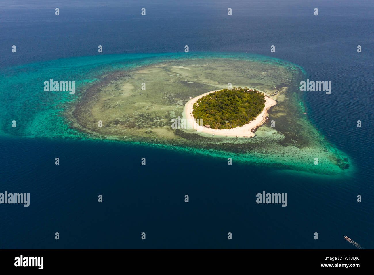 White sandy island with coral reefs.White sandbar.Atoll near the island ...