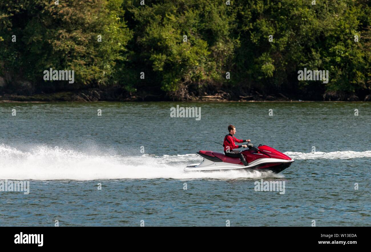 Teen on jet ski hi-res stock photography and images - Alamy