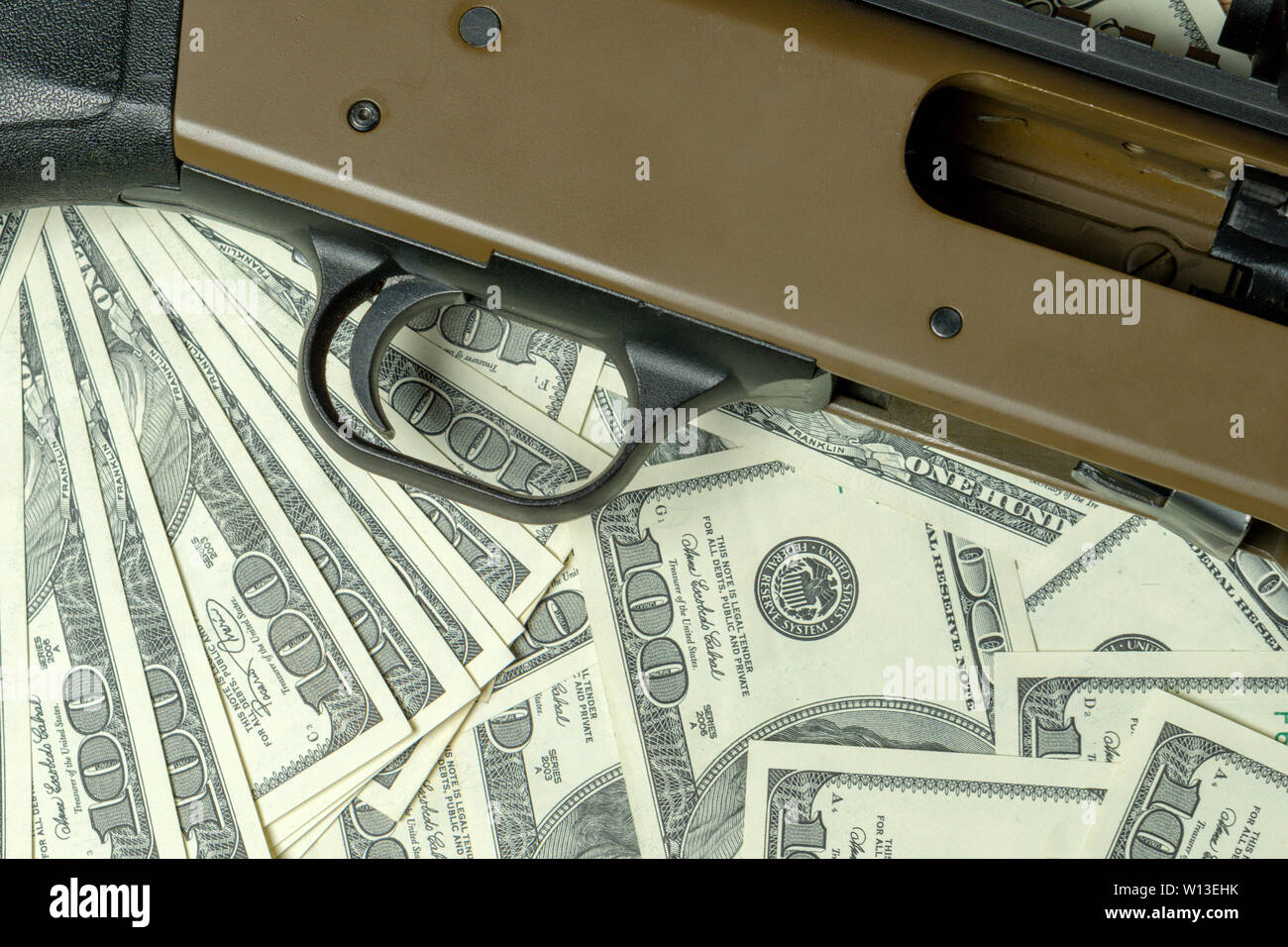 Shotgun on dollars. Crime, global arms trade, weapons sale. Illegal ...