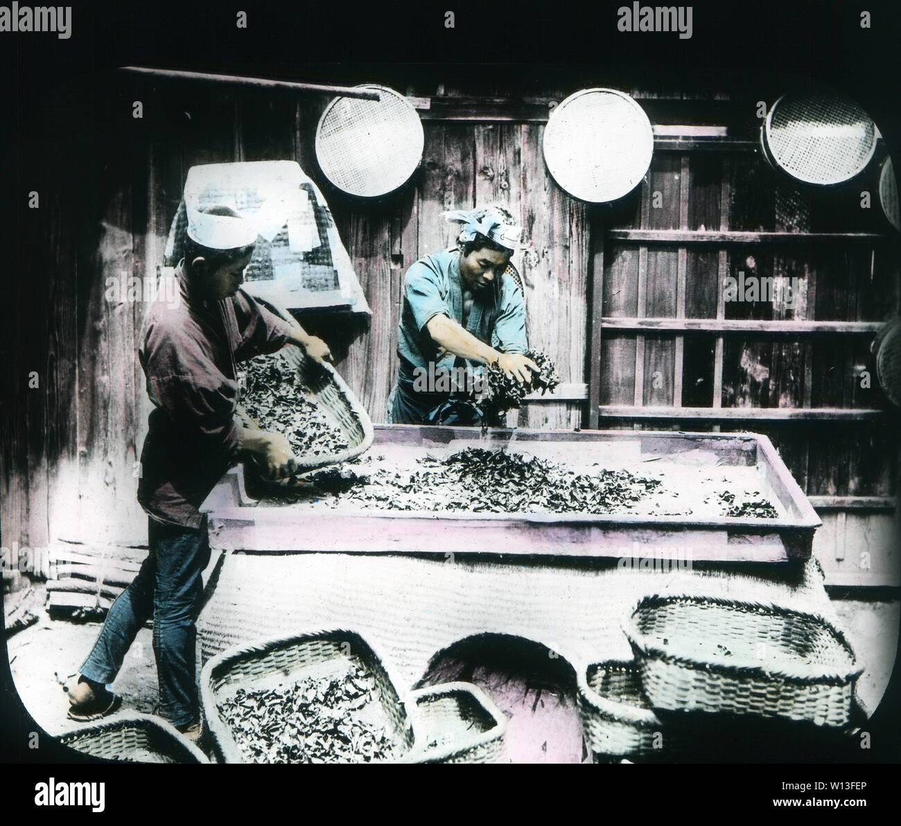 [ 1890s Japan - Firing Tea ] — Two men in happi coats are firing tea ...