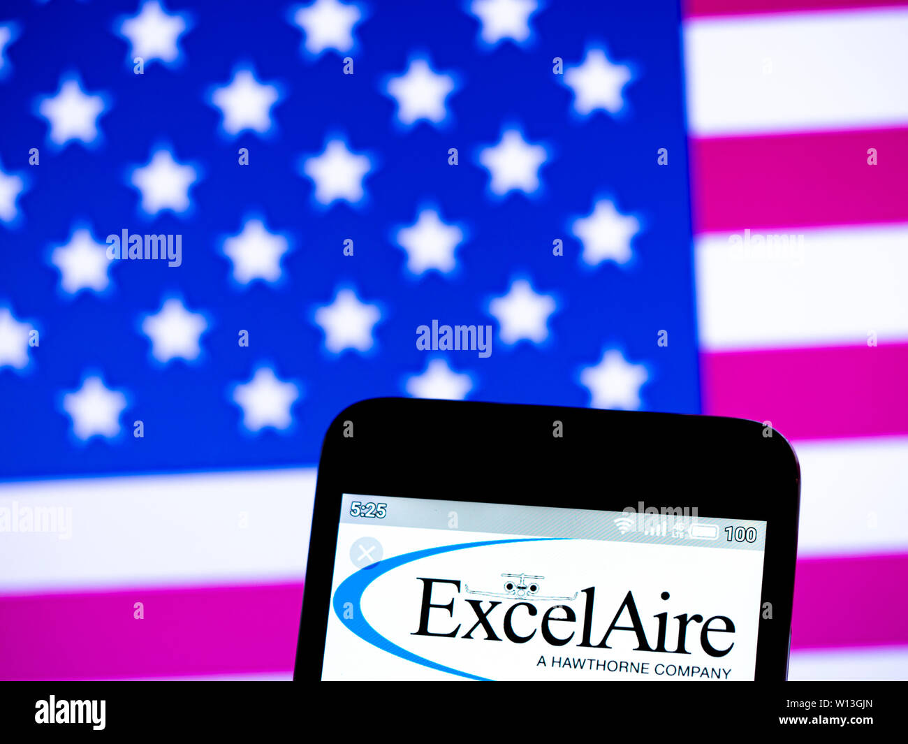 In this photo illustration the ExcelAire, LLC logo is seen displayed on ...