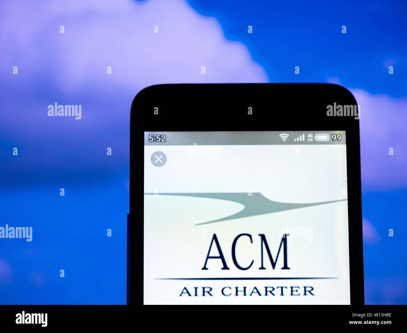 In this photo illustration the ACM Air Charter logo is seen displayed ...