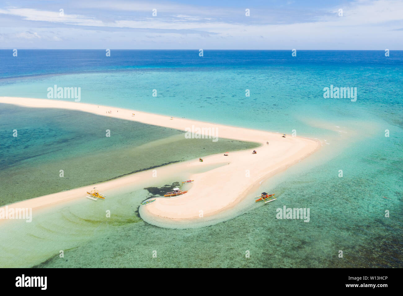 Atoll with an island of white sand. Sand beach island on a coral reef ...