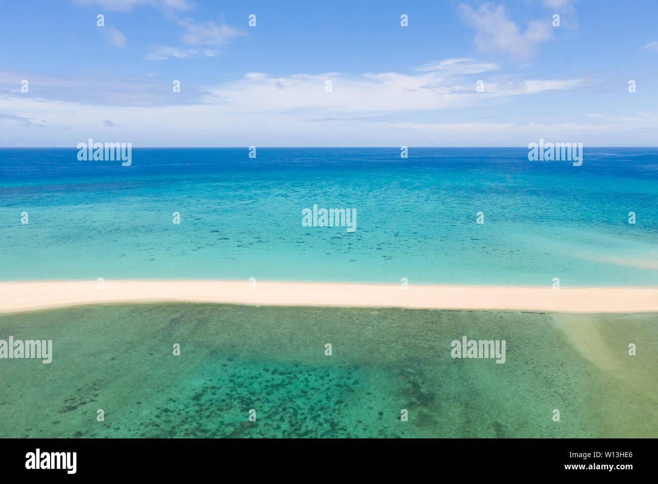 Sand beach island on a coral reef, top view. Atoll with an island of ...