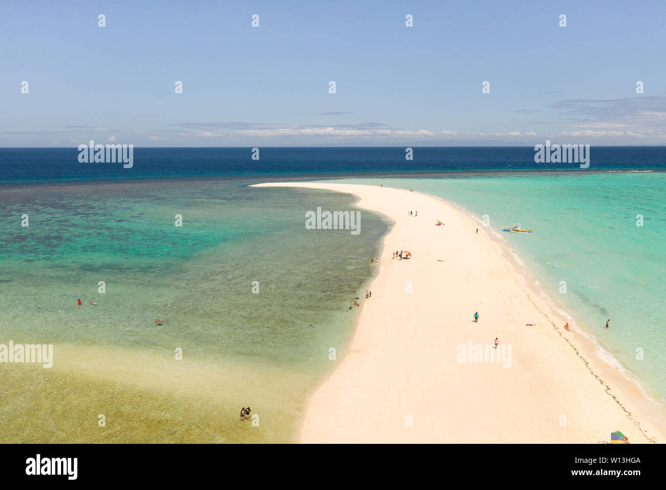 Atoll with an island of white sand. Sand beach island on a coral reef ...