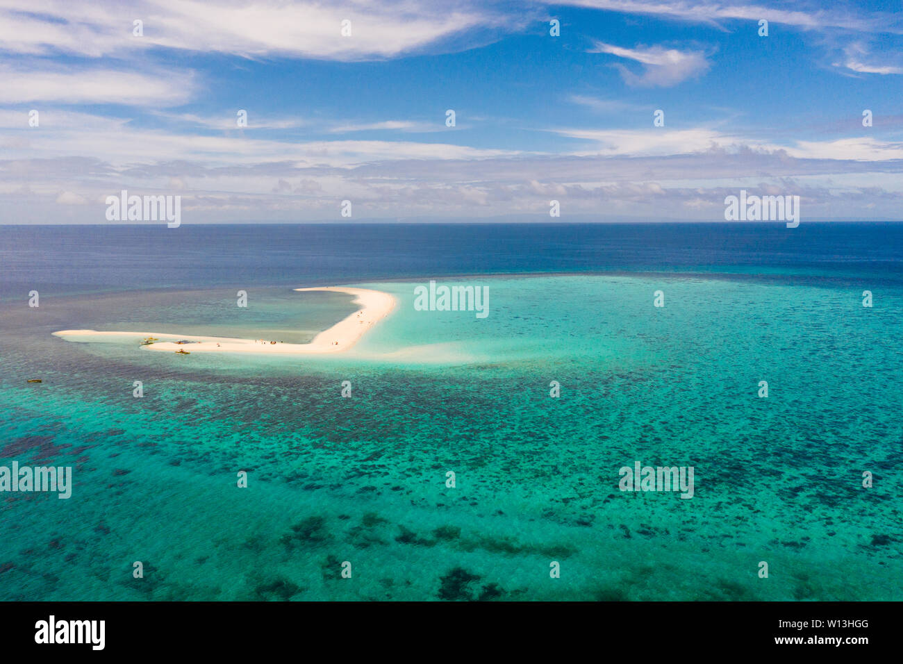 Atoll with an island of white sand. Sand beach island on a coral reef ...