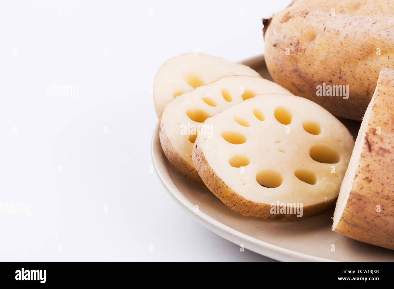 Fresh lotus root on white background Stock Photo - Alamy