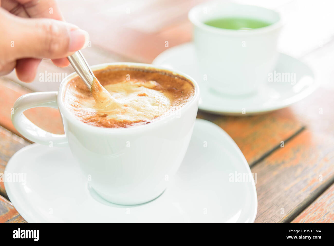Man hand stir coffee in hi-res stock photography and images - Alamy