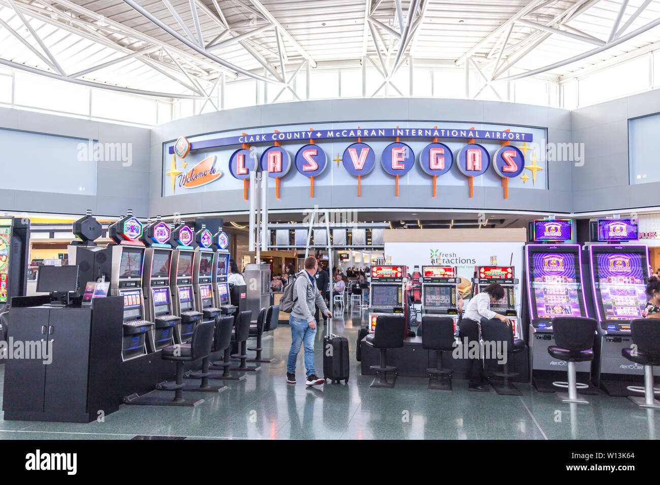 LAS VEGAS, NEVADA, USA - 13 MAY, 2019: People playing slot machines at ...