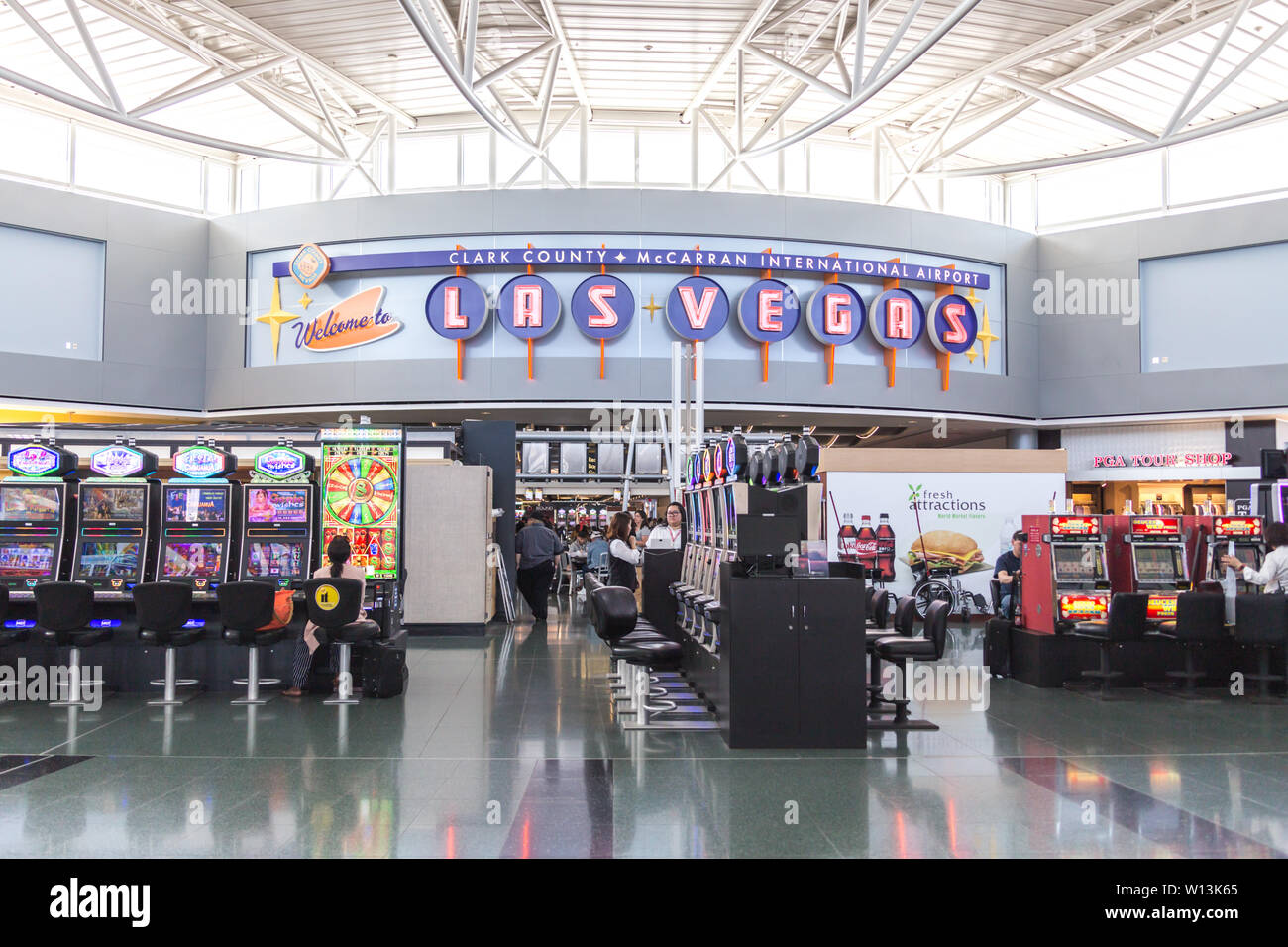 LAS VEGAS, NEVADA, USA - 13 MAY, 2019: People playing slot machines at ...