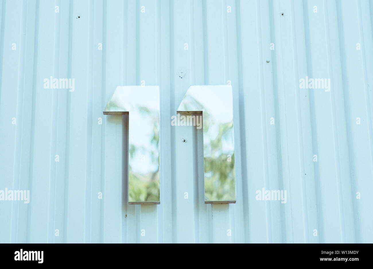 Large metallic mirrored number 11 sign Stock Photo - Alamy