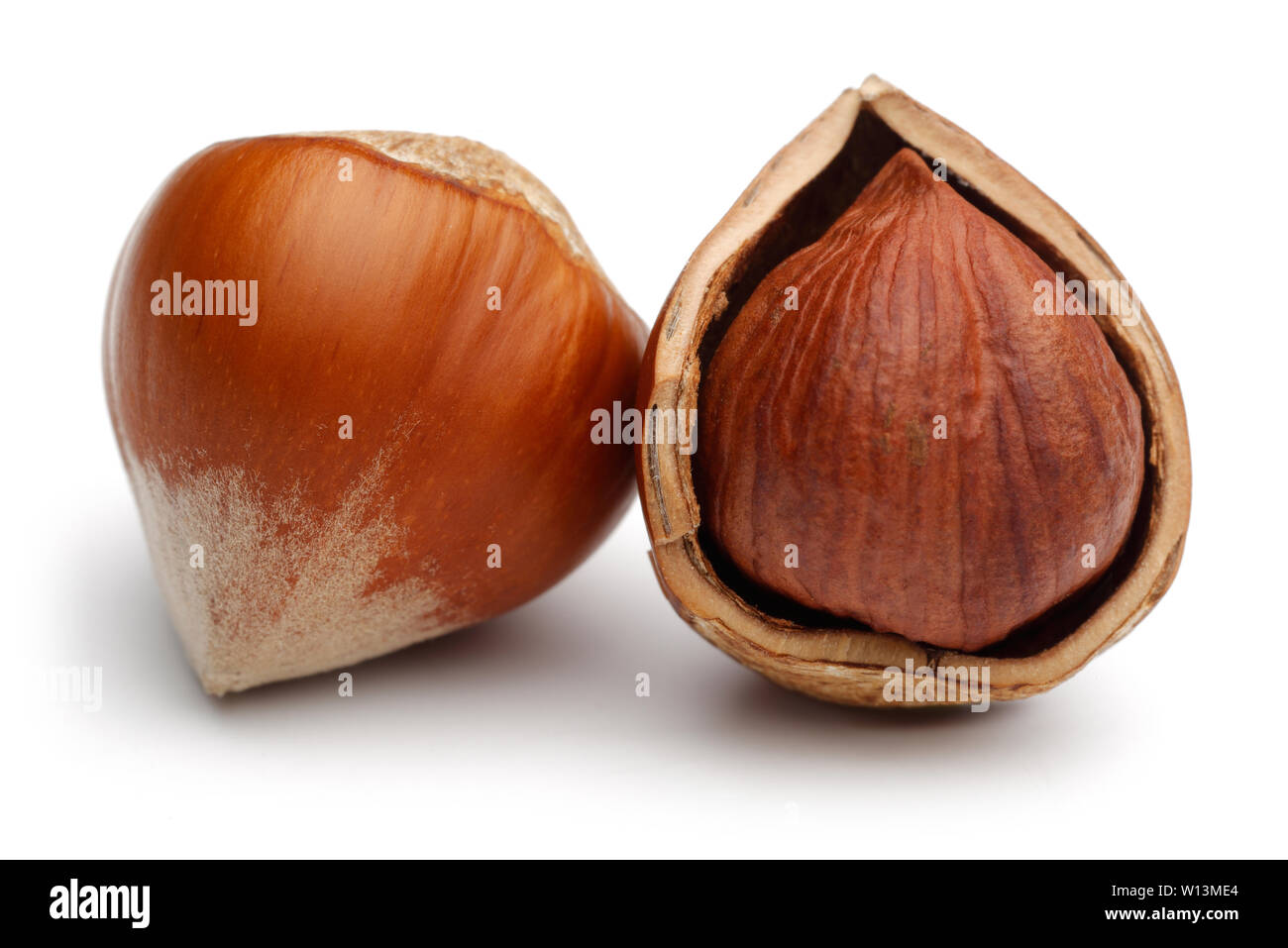 Whole and broken hazelnut isolated on white background Stock Photo - Alamy
